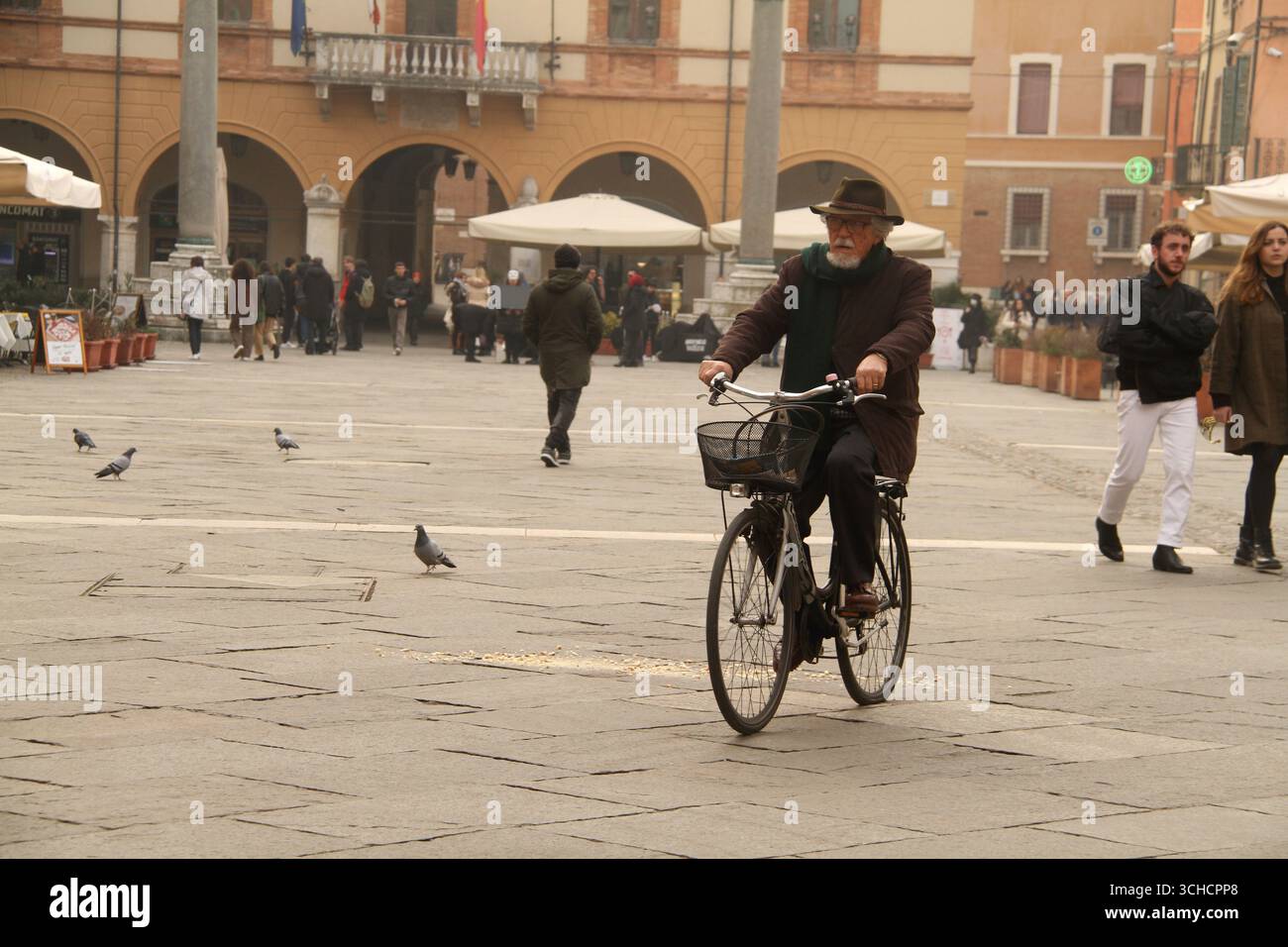 Elegant man riding bicycle hi-res stock photography and images - Alamy