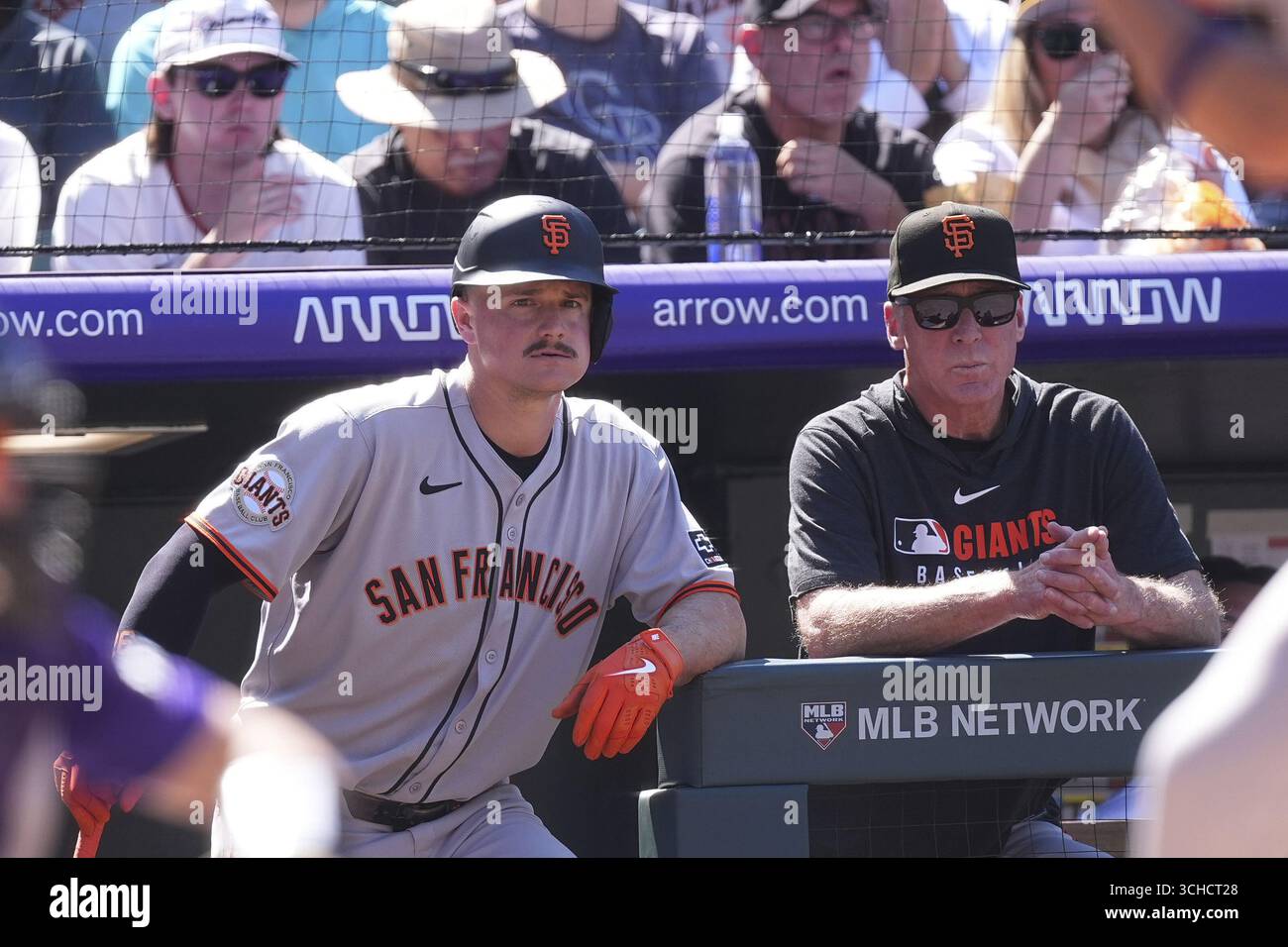 San Francisco Giants' Matt Chapman, left, and manager Bob Melvin lean ...