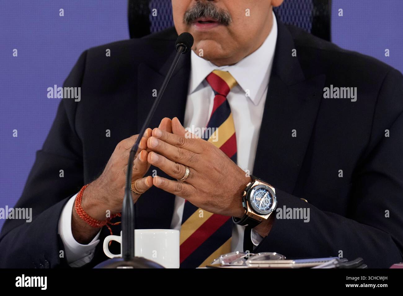 President Nicolas Maduro, wearing a watch soccer legend Diego Maradona ...