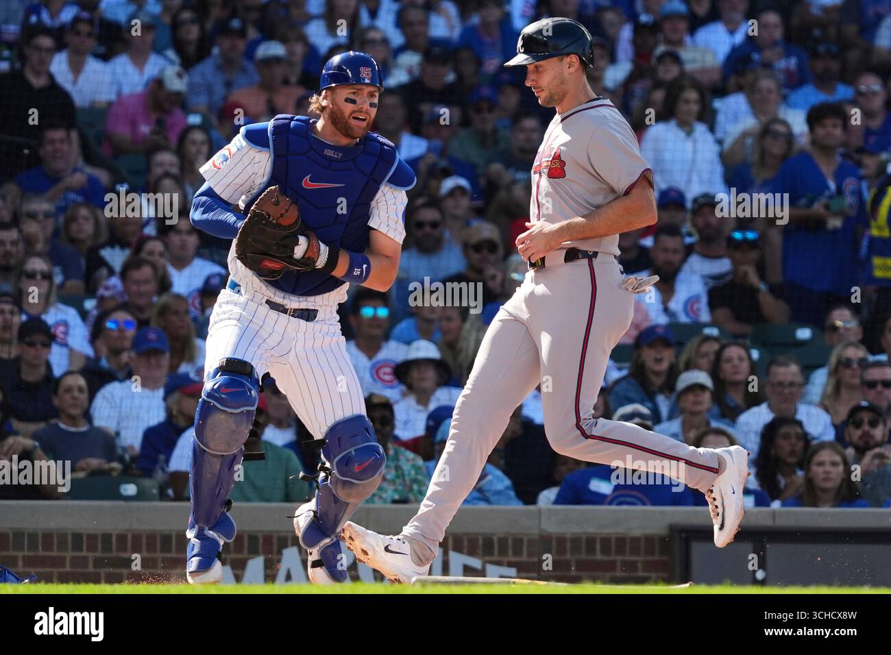 Chicago Cubs catcher Carson Kelly, left, looks to the field after ...
