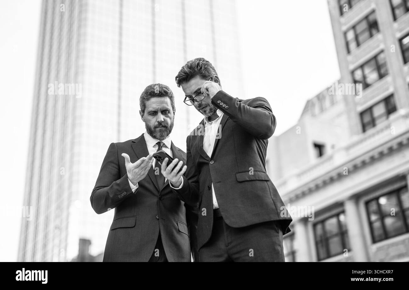 Businessmen in suit with phone. Online working. Businessmen checking ...
