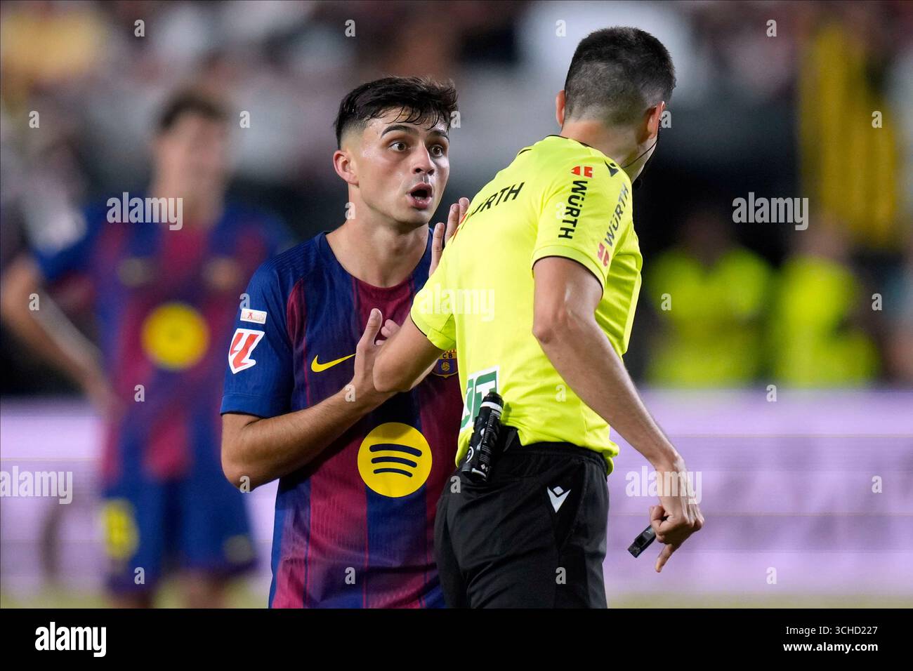 Pedri of FC Barcelona and referee Mateo Busquets Ferrer during the La ...
