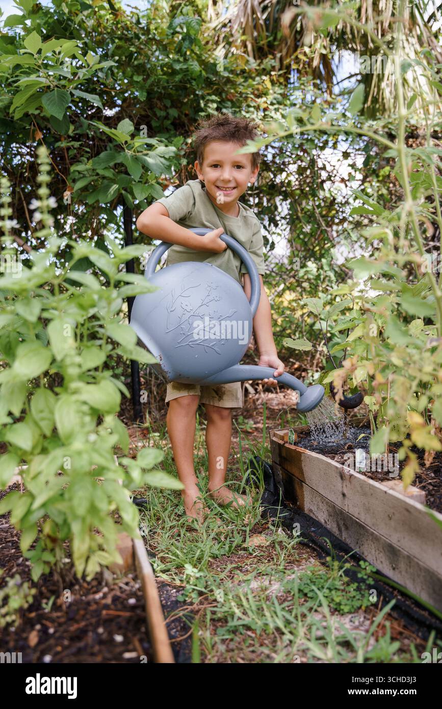 Boy takes care plants hi-res stock photography and images - Alamy