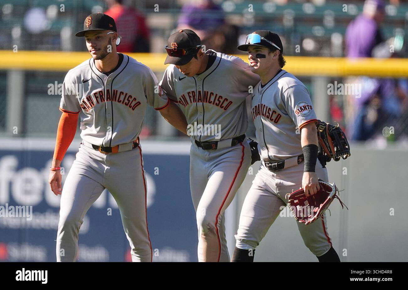 From left to right, San Francisco Giants left fielder Grant McCray ...