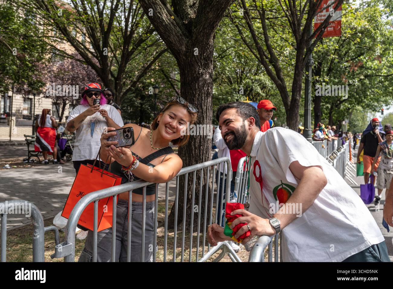 Mayoral candidate Zohran Mamdani greets people while walking West ...