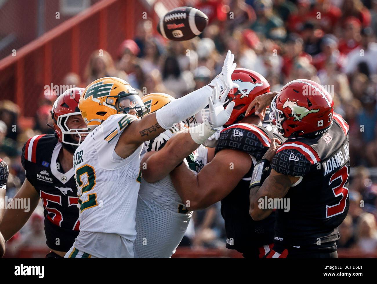 Edmonton Elks' Noah Taylor, left, tries to block a pass from Calgary ...