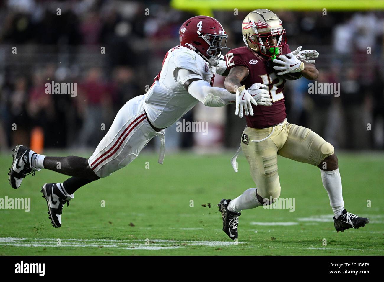 Florida State running back Jaylin Lucas (12) is tackled by Alabama ...