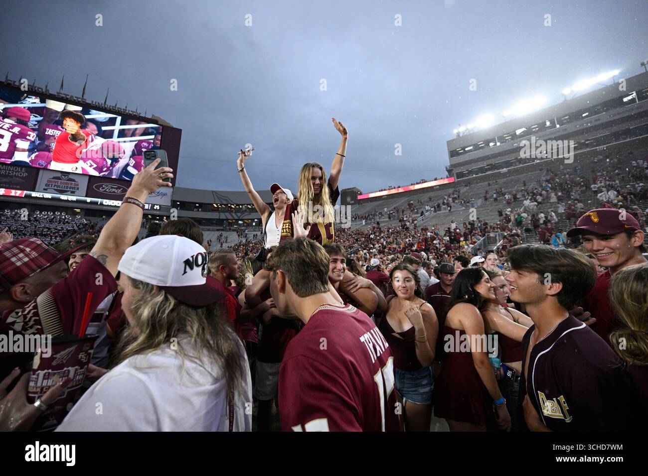 Florida State fans celebrate on the field after a win against Alabama ...