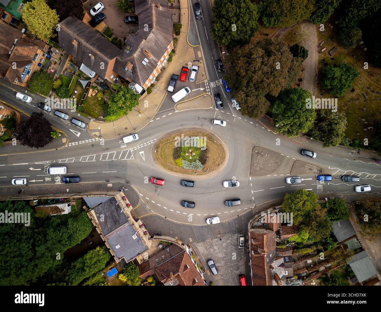 Aerial view of traffic flowing around a roundabout in a small town in ...