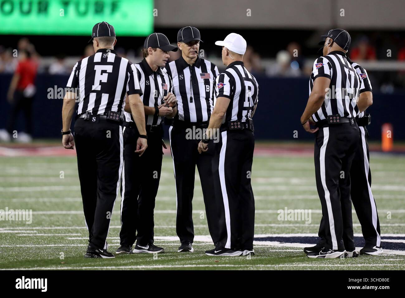 TUCSON, AZ - AUGUST 30: Head referee Stephen Baron and crew discuss a ...
