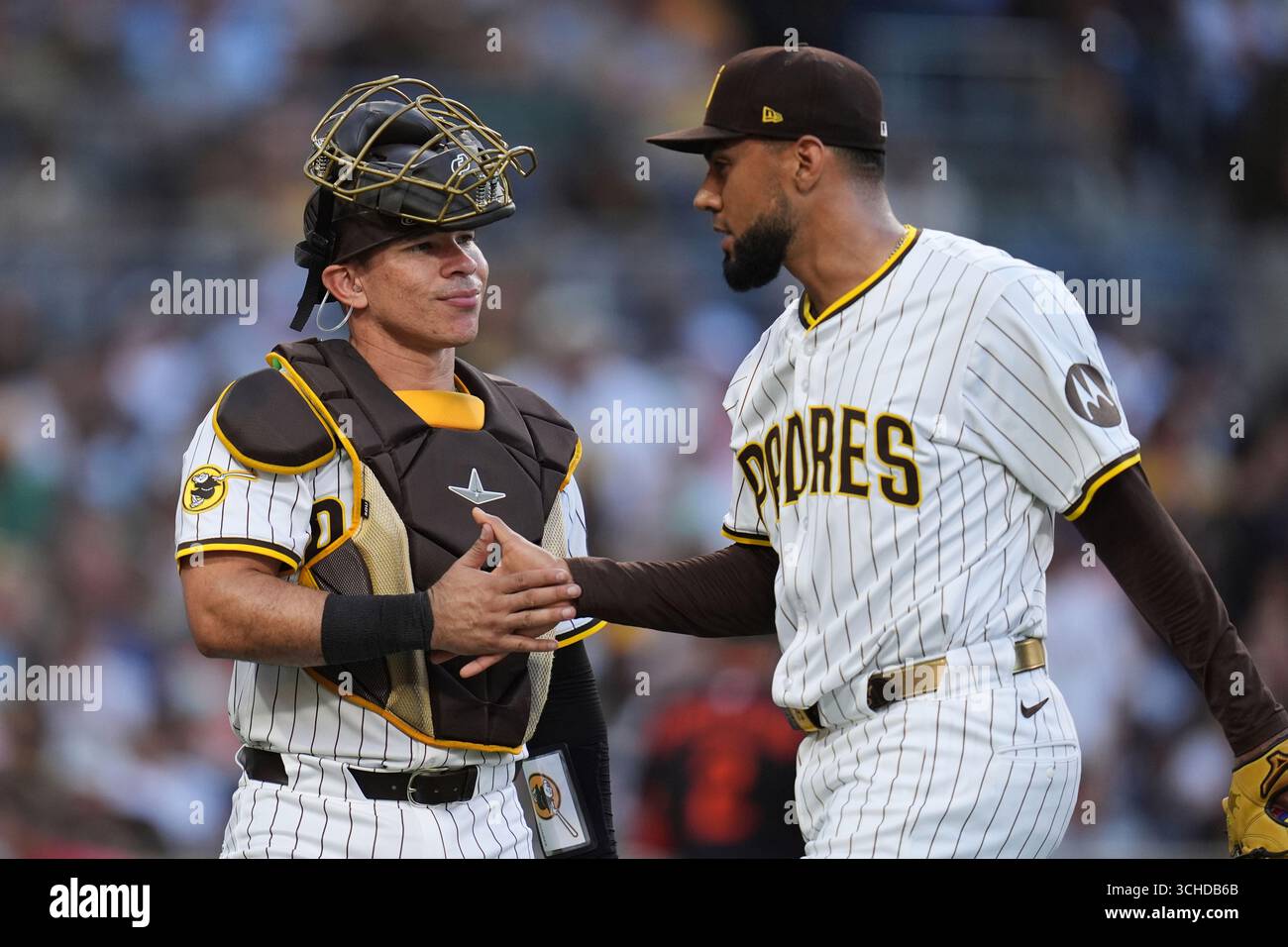 San Diego Padres catcher Freddy Fermin, left, shakes hands with relief ...
