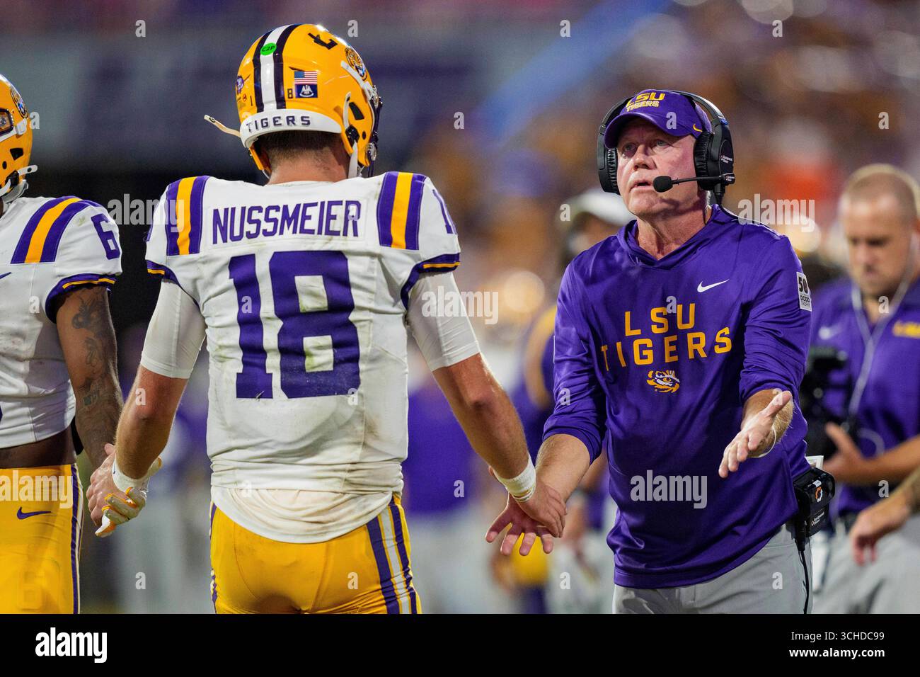 LSU head coach Brian Kelly celebrates with quarterback Garrett ...