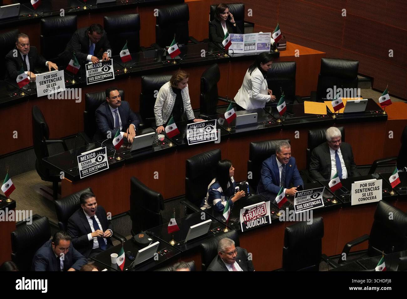Opposition senators hold up signs protesting the government's judicial ...