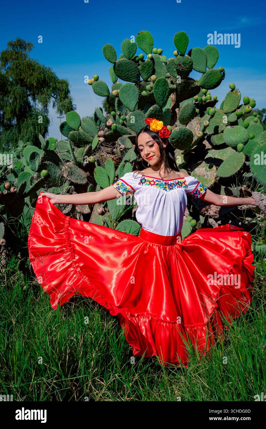 Latina woman in Mexican folkloric costume surrounded by nature Stock ...