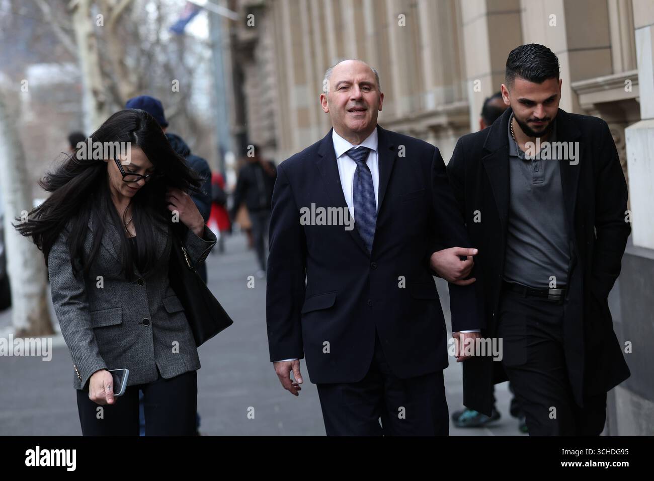 Tony Mokbel (centre) leaves the Court of Appeal, in Melbourne, Tuesday ...