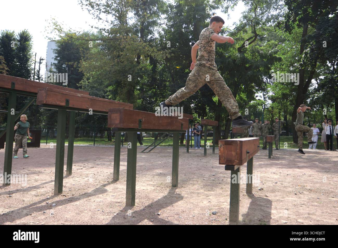 Non Exclusive: A cadet goes down a log ladder that is part of the ...
