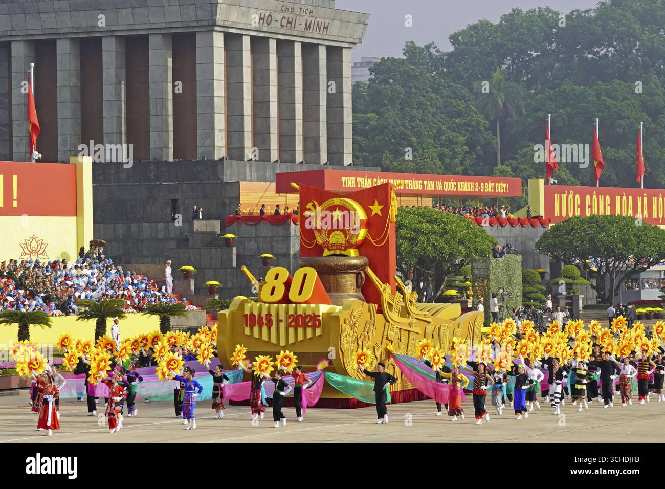 People march at a ceremony celebrating the 80th anniversary of Vietnam ...