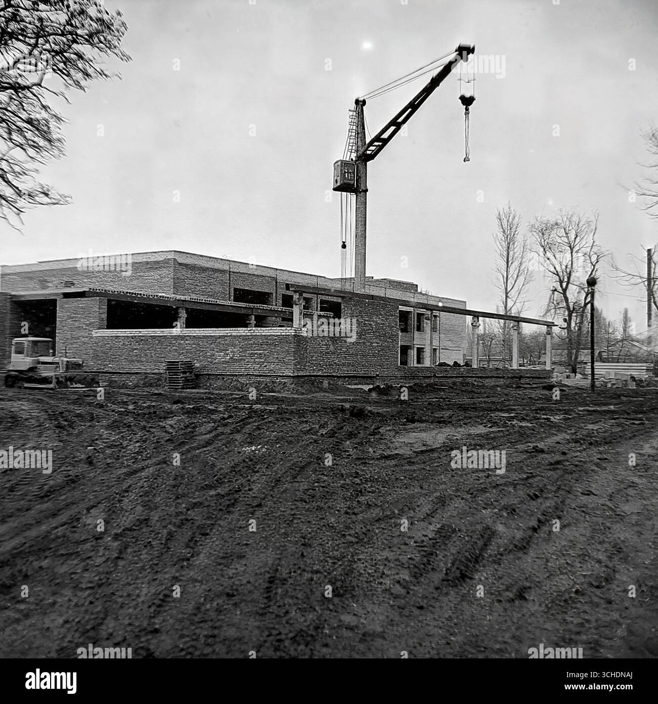 A historical shot capturing the construction of a new modern building ...
