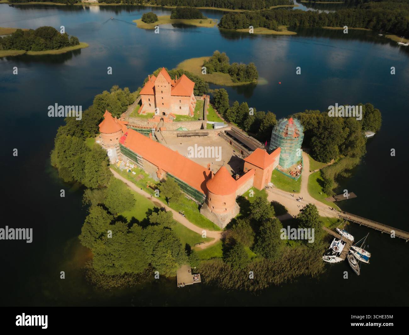 Aerial view of Trakai Island Castle, a medieval fortress with red brick ...