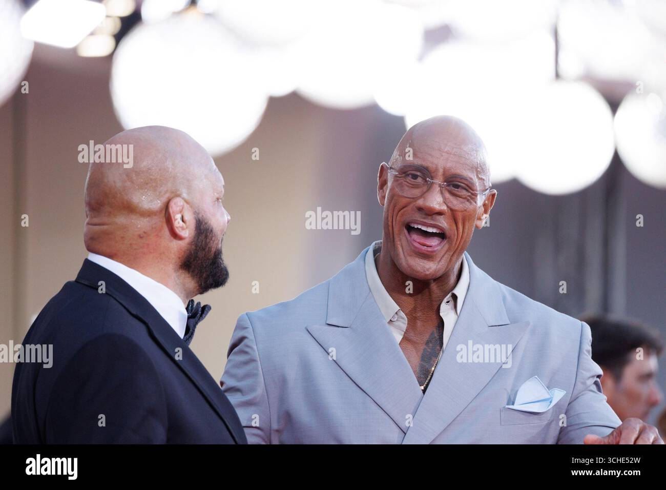 Dwayne Johnson and Mark Kerr attend "The Smashing Machine" red carpet ...