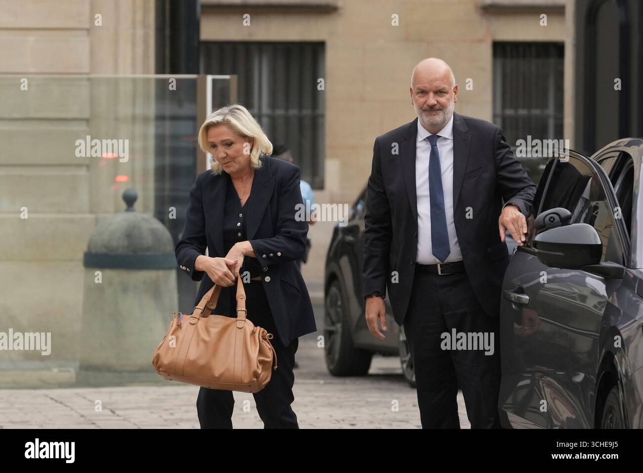 French far right leader Marine Le Pen, left, arrives to meet French ...