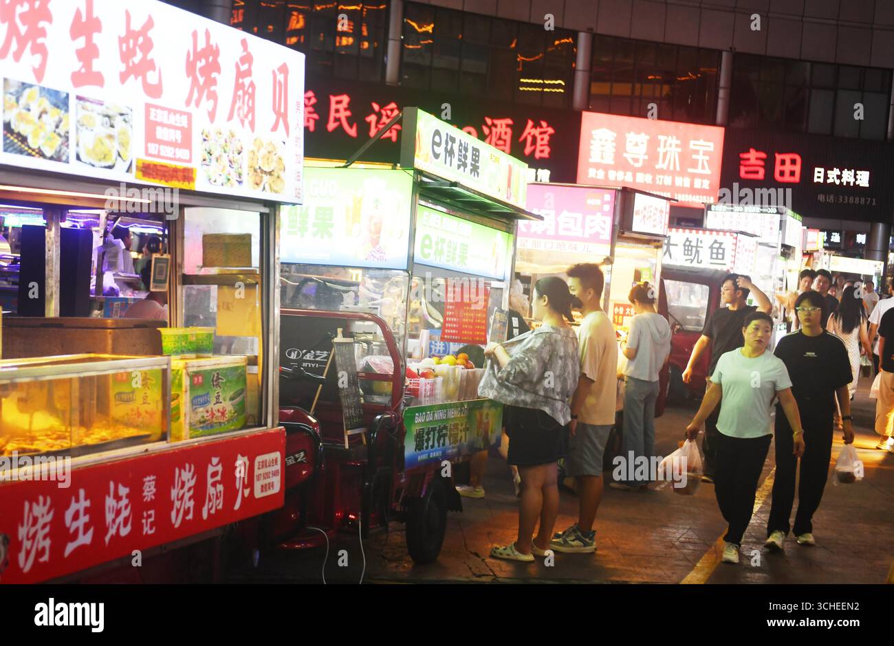 Aerial photo shows the bustling night market in Lu'an City, east China ...