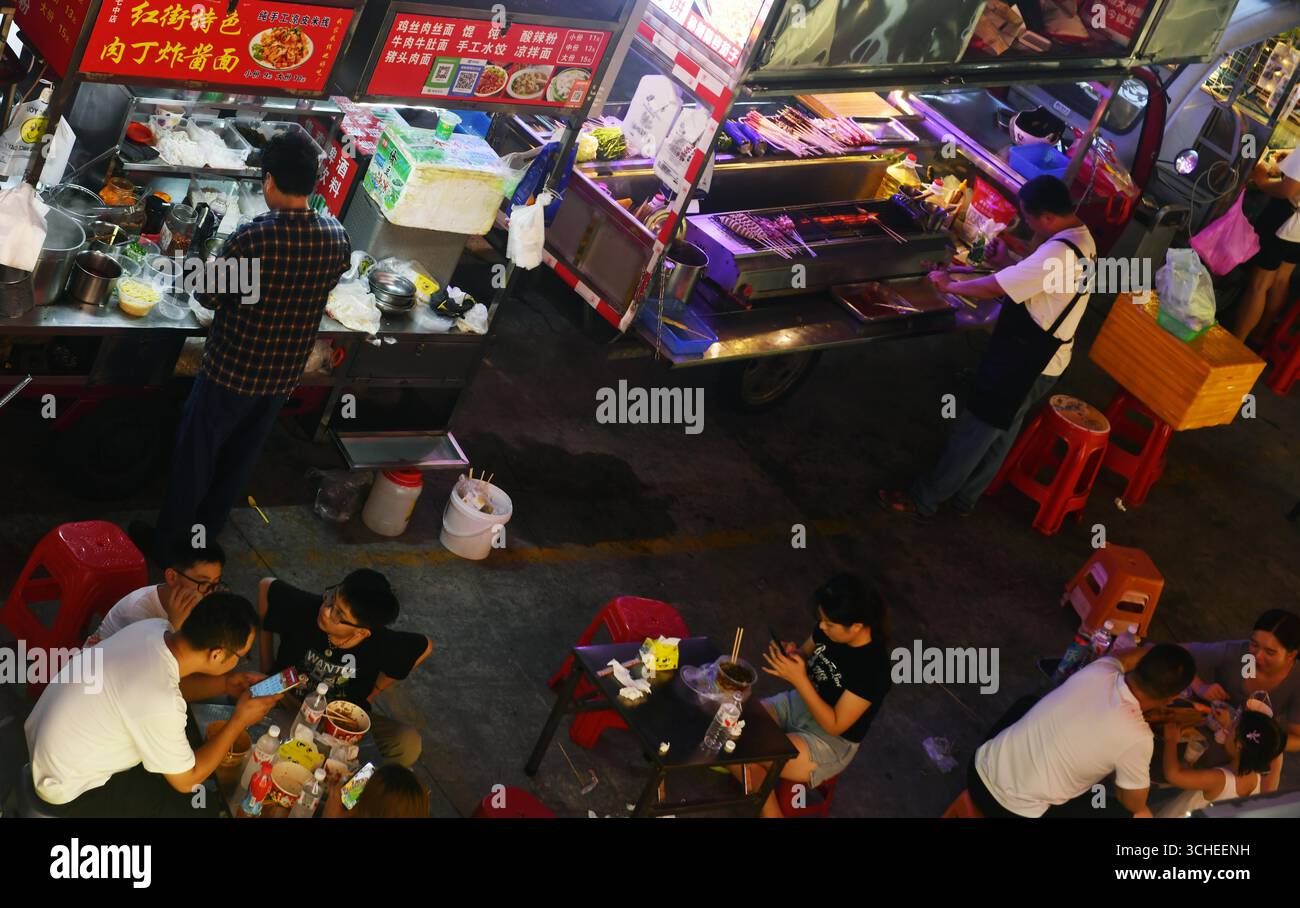 Aerial photo shows the bustling night market in Lu'an City, east China ...