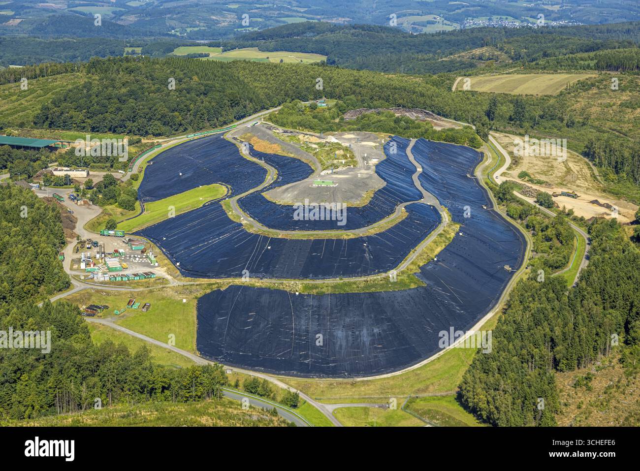 Heap waste covered tarpaulin hi-res stock photography and images - Alamy