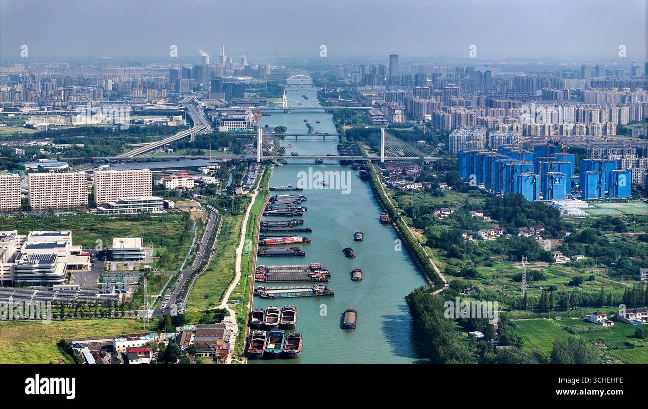 Aerial photo shows cargo ships sailing in the Grand Canal in Yangzhou City, east China's Jiangsu ...
