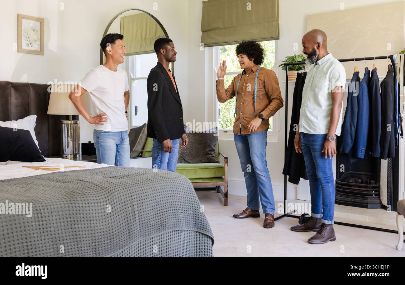 Diverse male friends fitting black hi-res stock photography and images ...