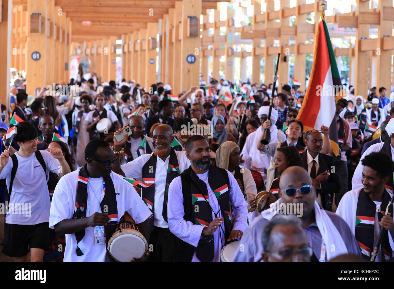 The photo shows the Sudanese Parade at the 2025 Osaka-Kansai Expo ...