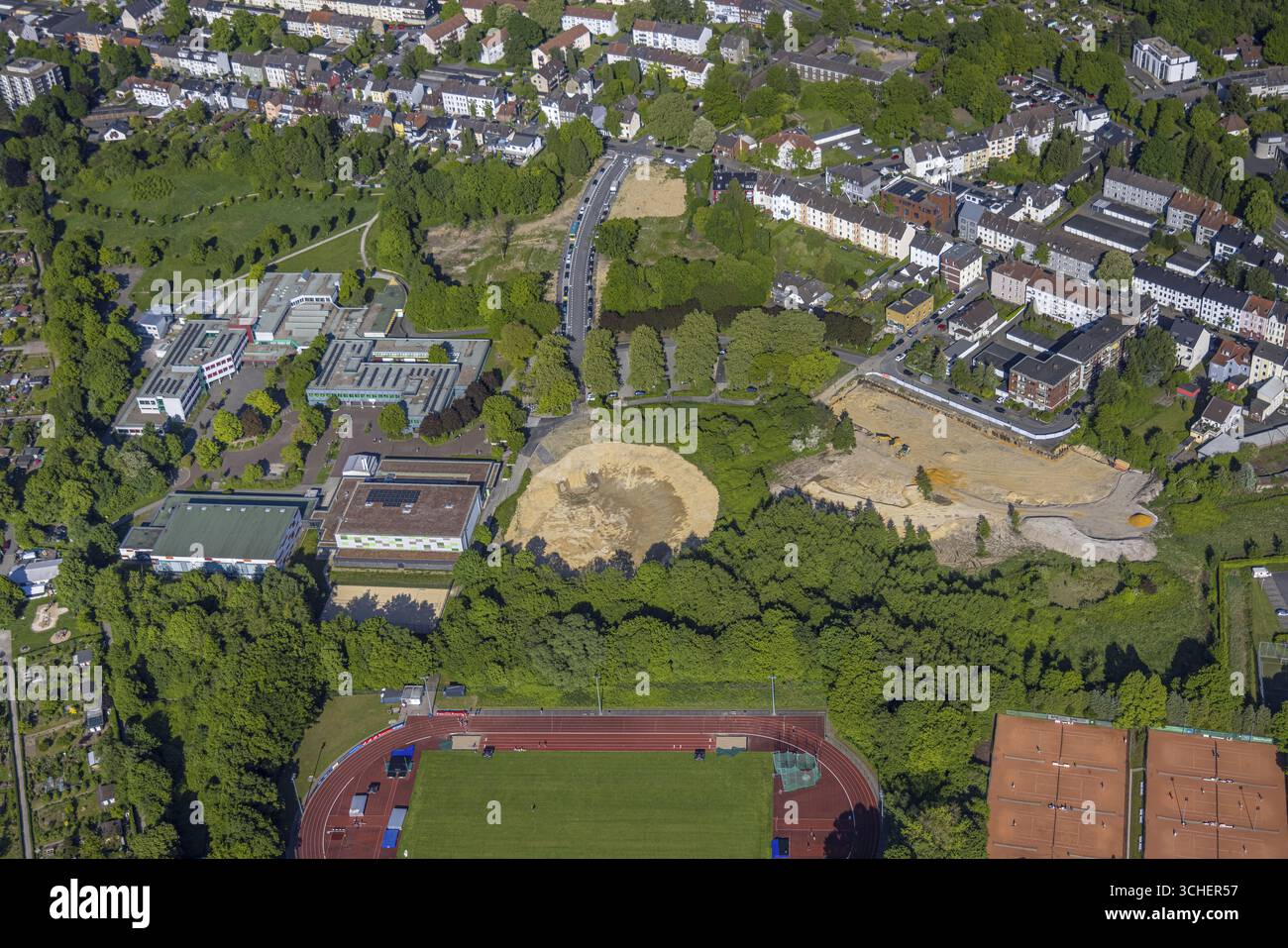 Aerial view, construction site with new construction of a triple sports ...