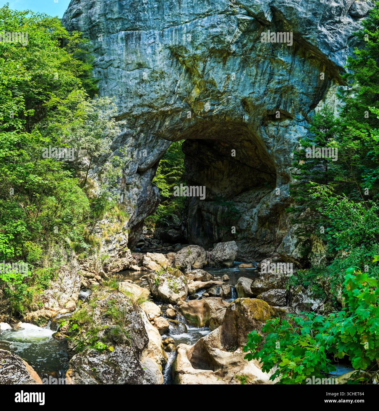 Stone arch bridge towering above hi-res stock photography and images ...