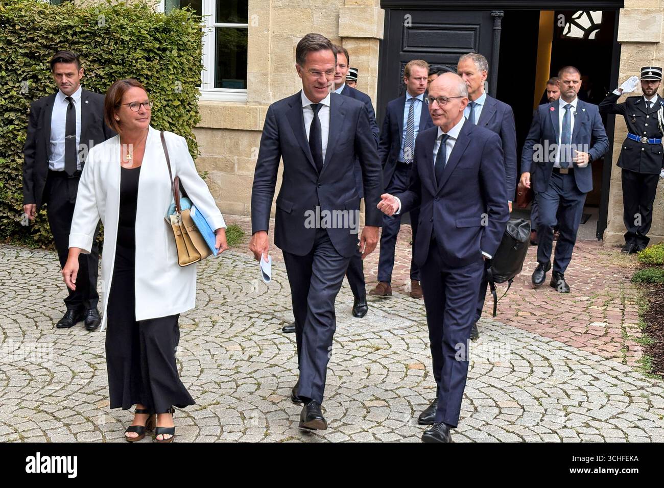 NATO Secretary General Mark Rutte, center, walks with Luxembourg's ...