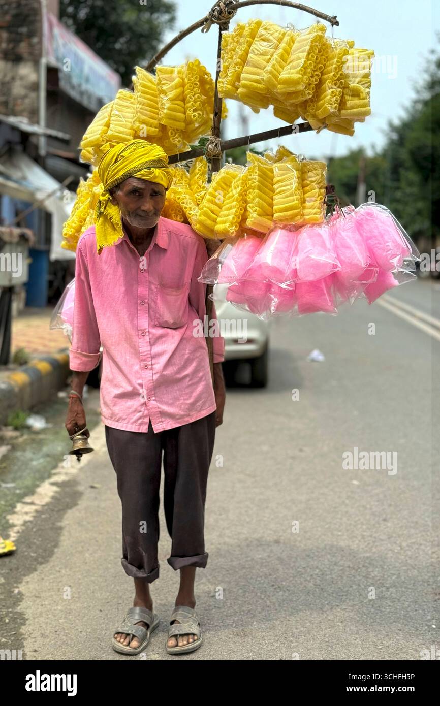 A vendor selling snacks looks for buyers in Prayagraj, India, Tuesday ...