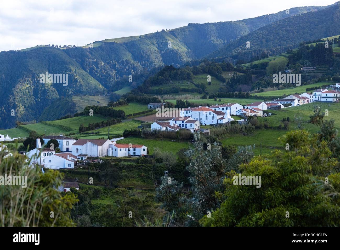 Green hills and traditional white houses in Azores islands Portugal ...
