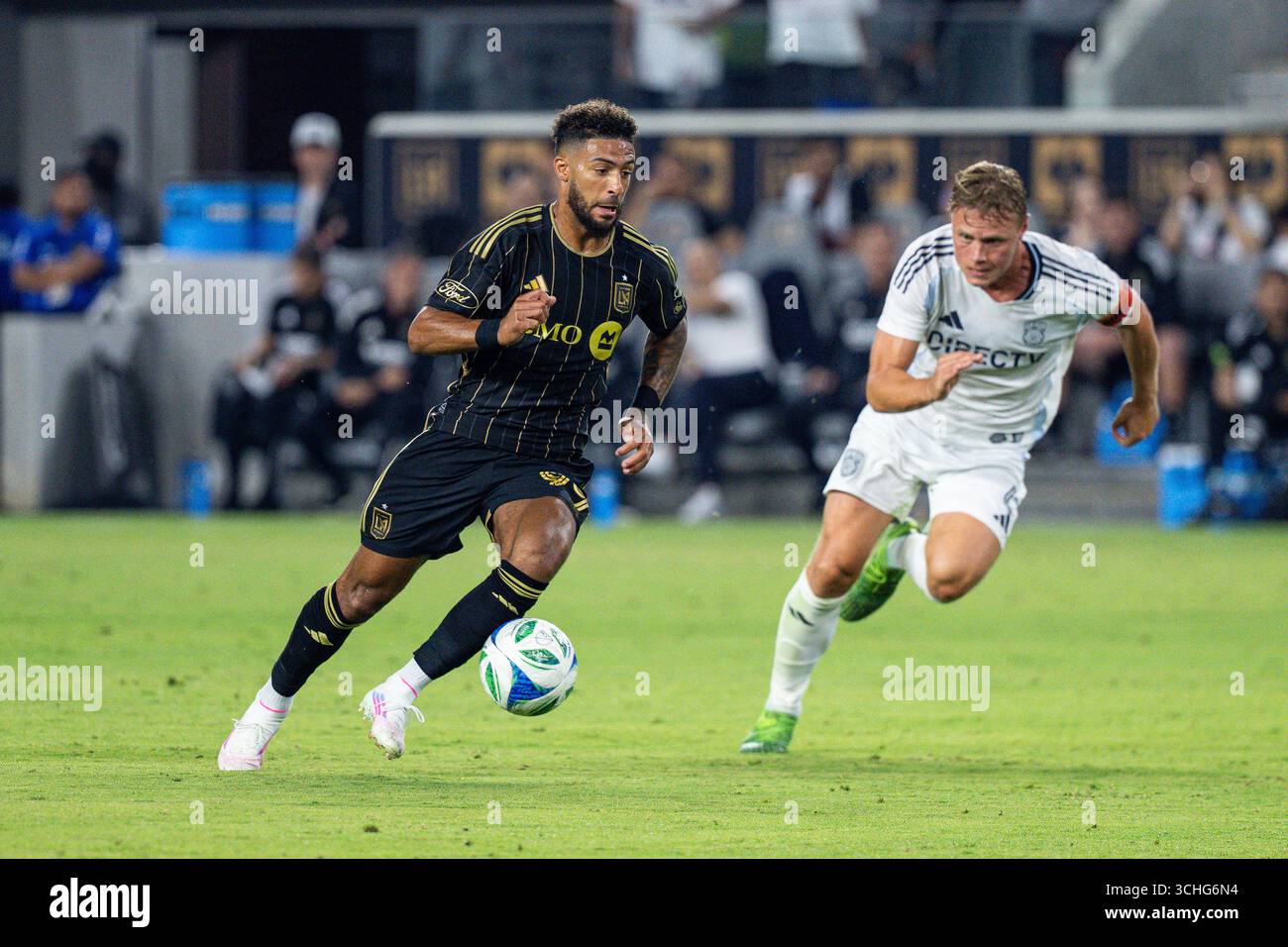 LAFC forward Denis Bouanga (99) gets past San Diego FC defender Jeppe Tverskov (6) during a MLS ...