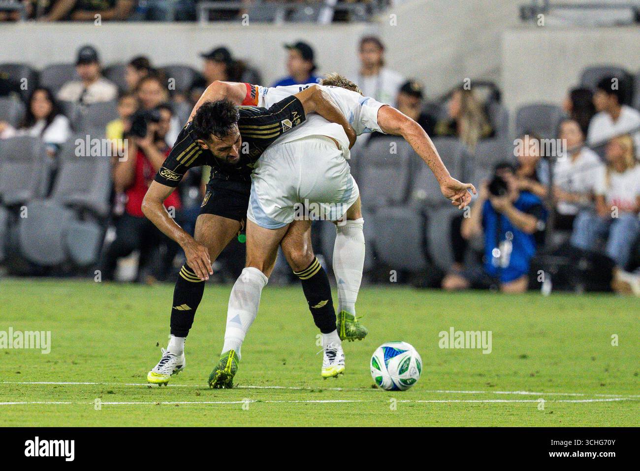 LAFC midfielder Mathieu Choinière (66) fouls San Diego FC defender ...