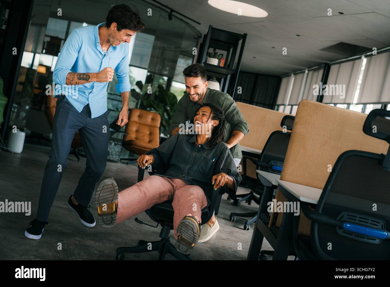 Portrait of overjoyed young diverse employees workers in creative ...