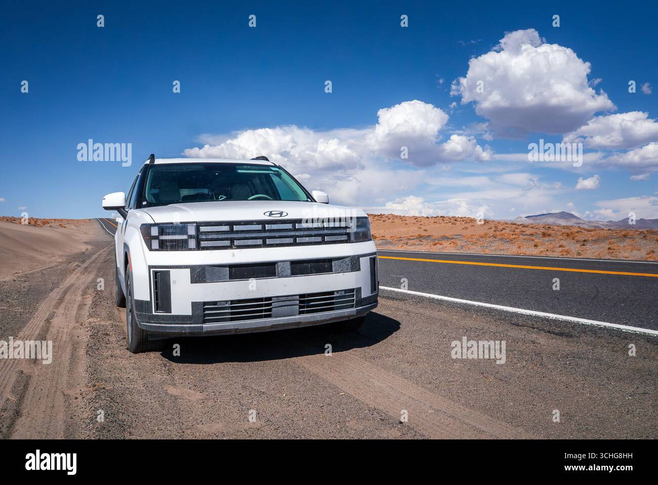 White Hyundai SUV Parked on Desert Road in Nevada Under Blue Sky Stock ...