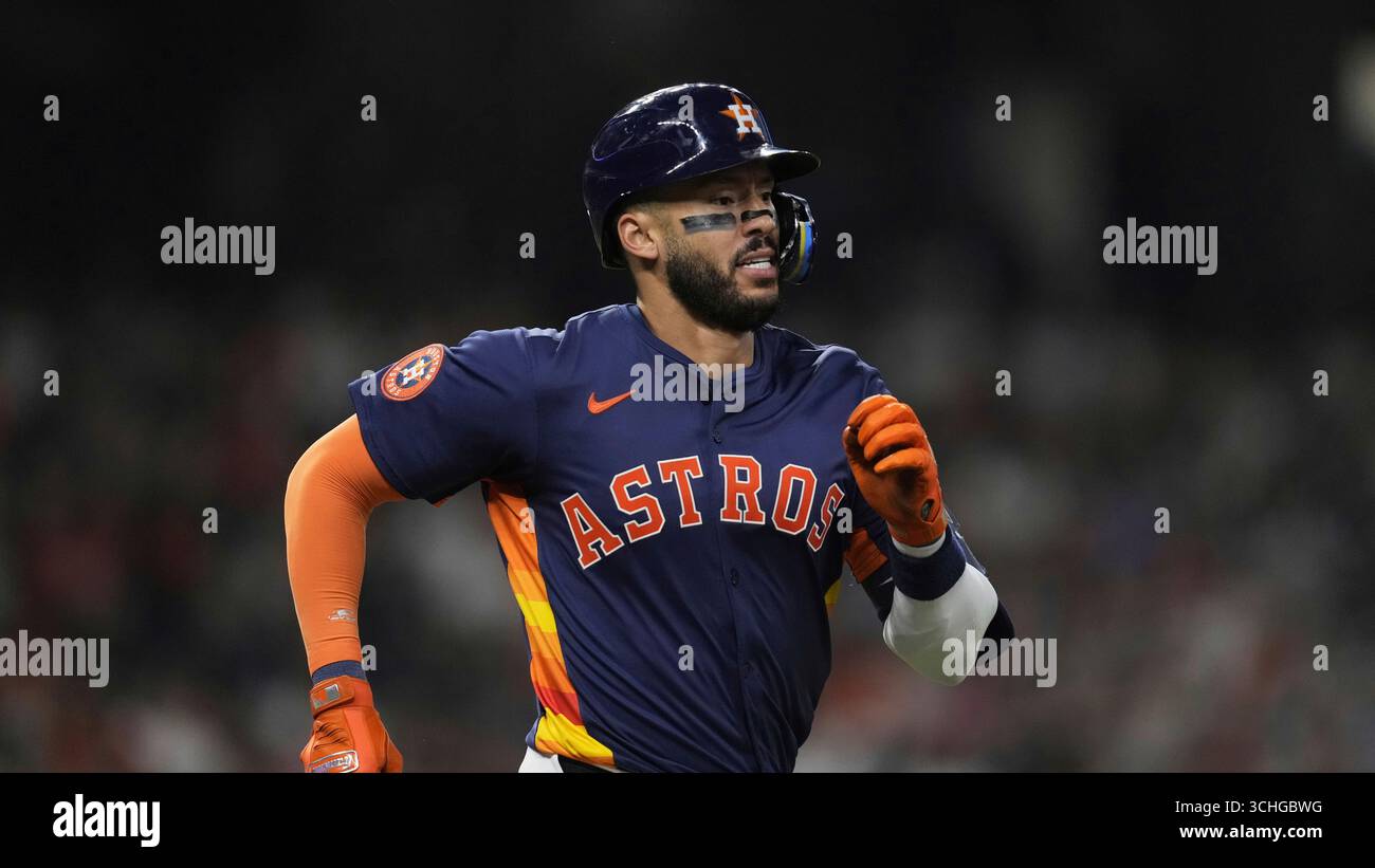 Houston Astros' Carlos Correa runs to first base during a baseball game ...