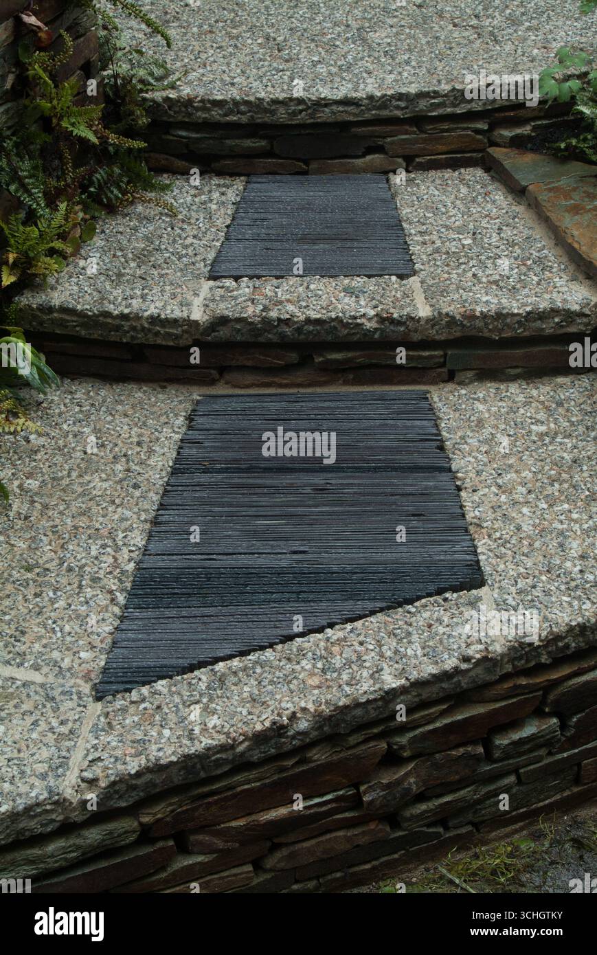 Stone steps feature textured black sections, creating a visually ...