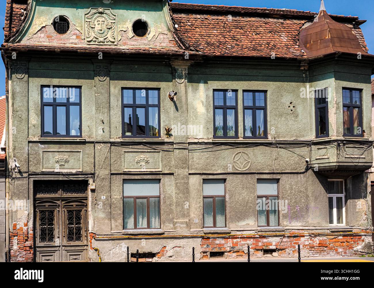 Brasov Romania August 2025 Historic building with weathered green ...
