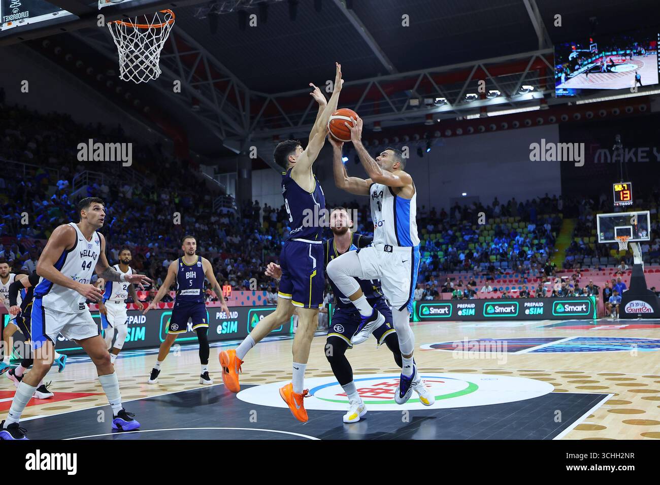 Greece's Kostas Sloukas, left, shoots next to Bosnia's Amar Gegic ...