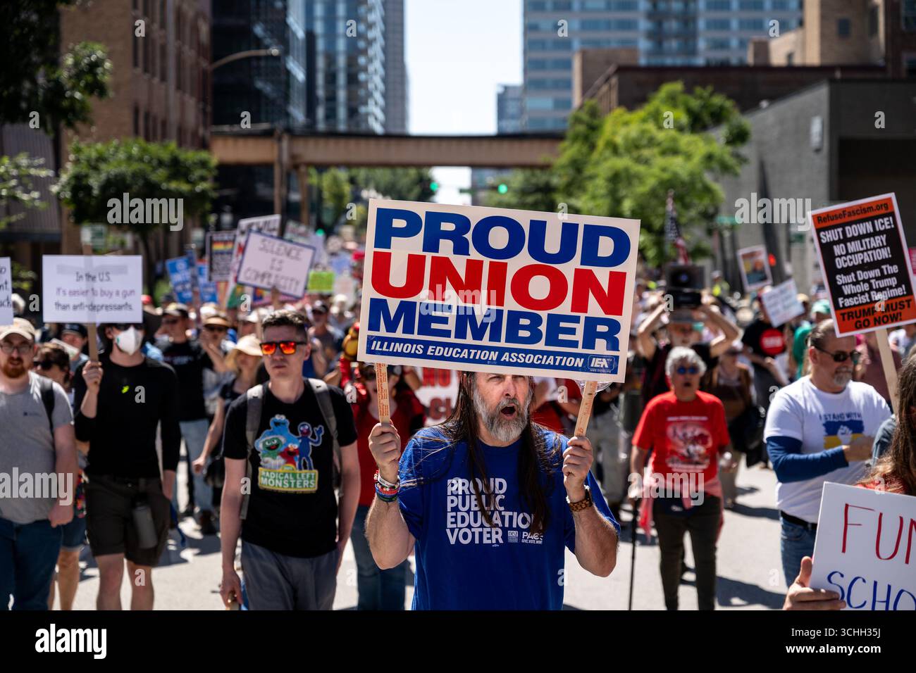 Protestors hold a rally and march on Labor Day in Chicago, IL on Monday ...