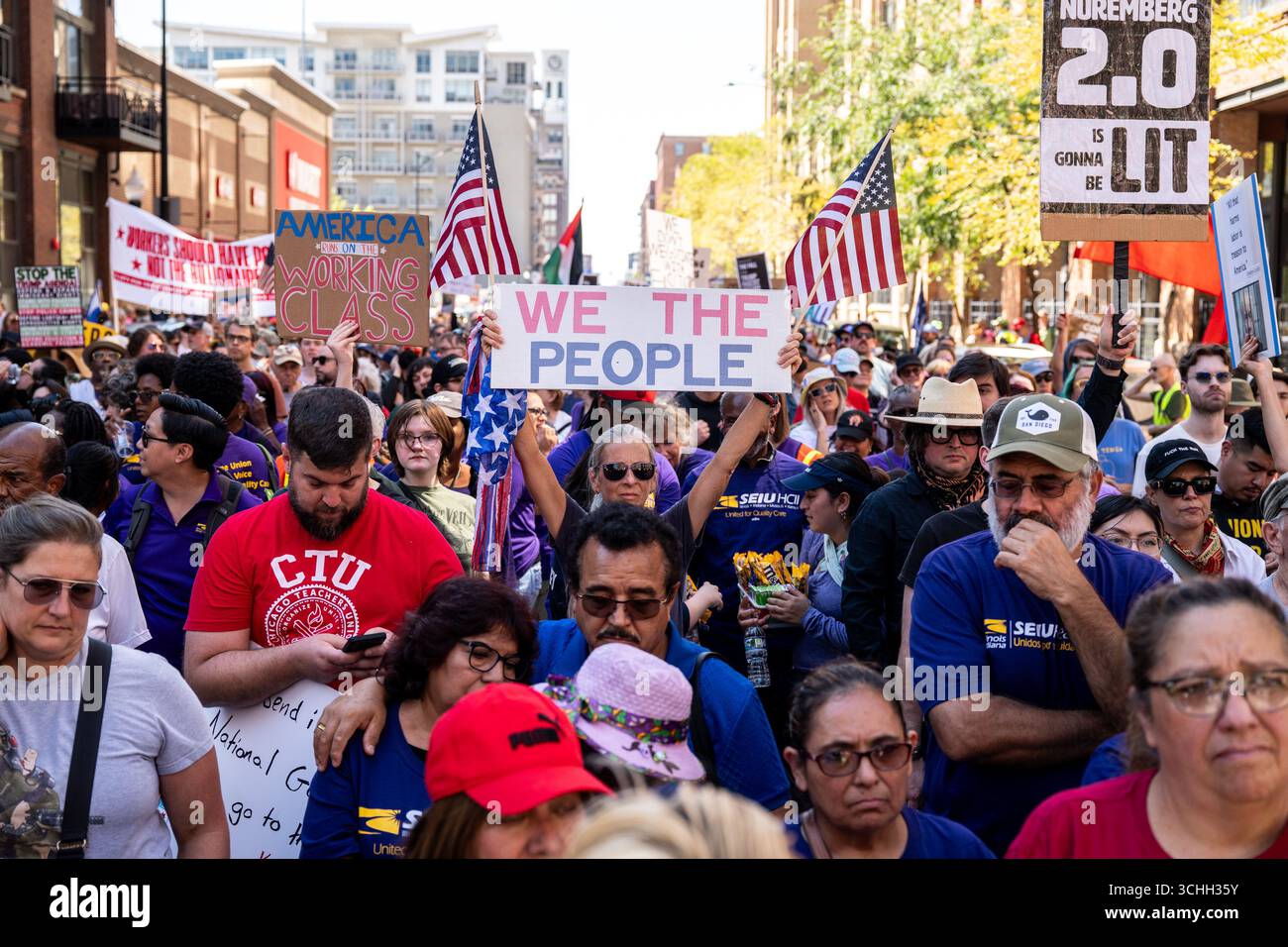 Protestors hold a rally and march on Labor Day in Chicago, IL on Monday ...