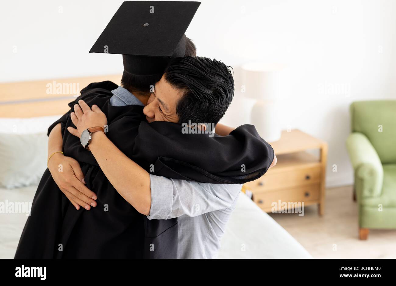 Asian father hugging graduate hi-res stock photography and images - Alamy