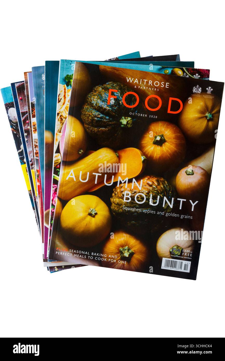 Pile of Waitrose & Partners Food magazine isolated on white background ...