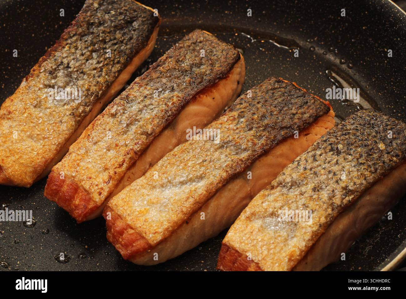 Closeup of Seared Salmon Fillets Skin Side Up Stock Photo - Alamy