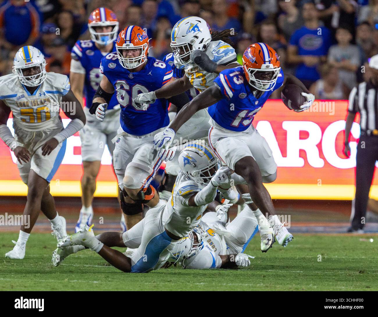 Florida running back Jadan Baugh (13) runs during the first half of an NCAA college football ...